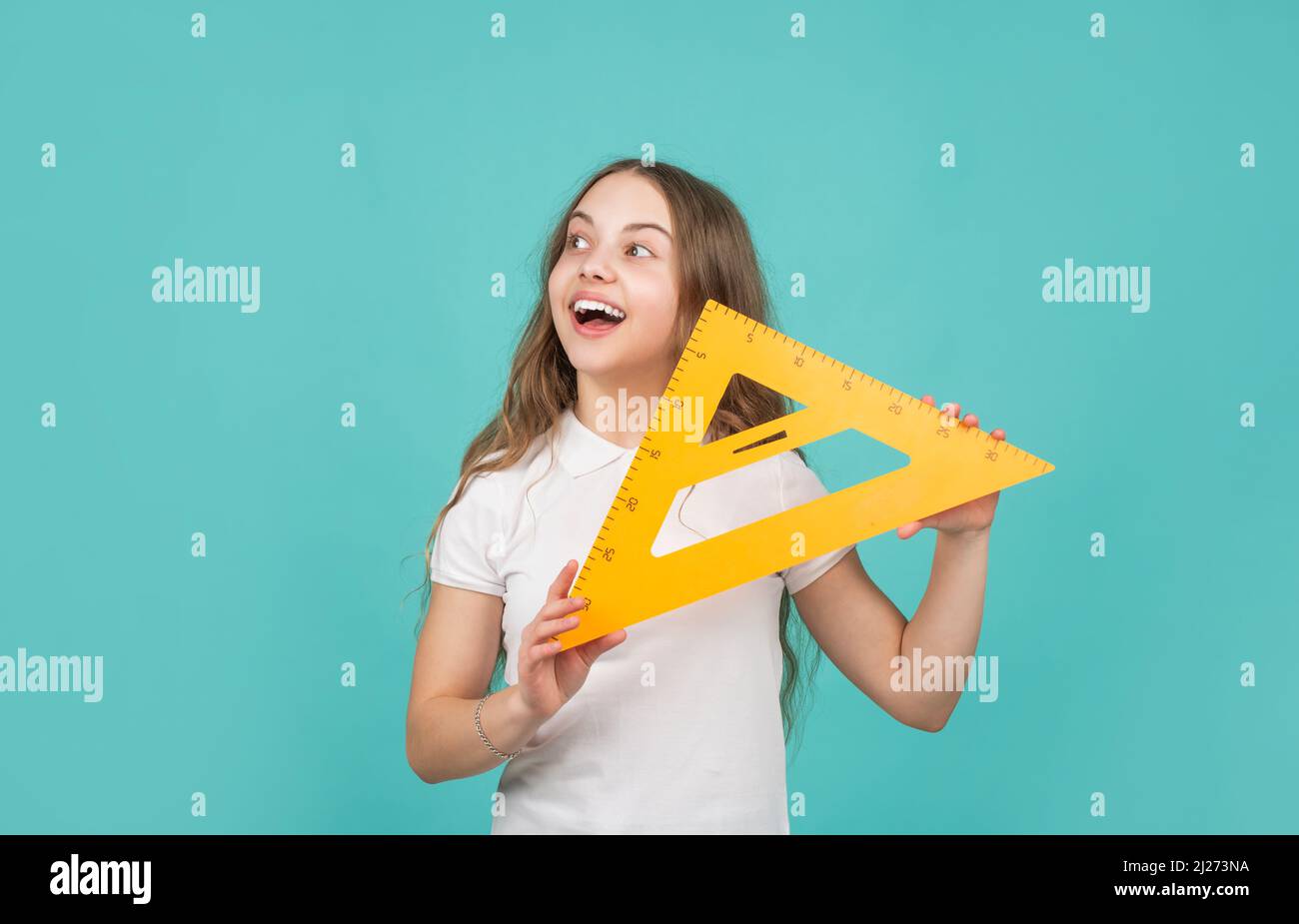 cheerful child with math triangle measuring tool Stock Photo - Alamy