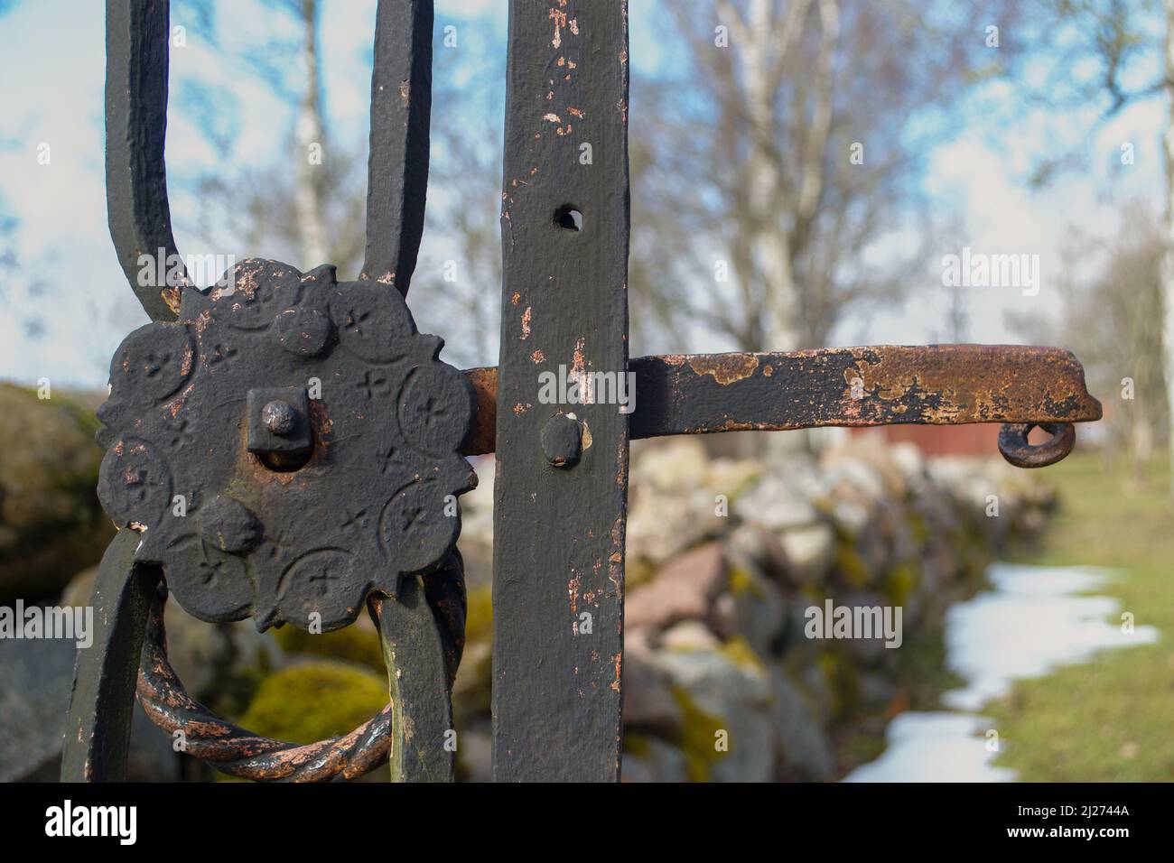 Detail of the lock on the old wrought iron gate Stock Photo - Alamy
