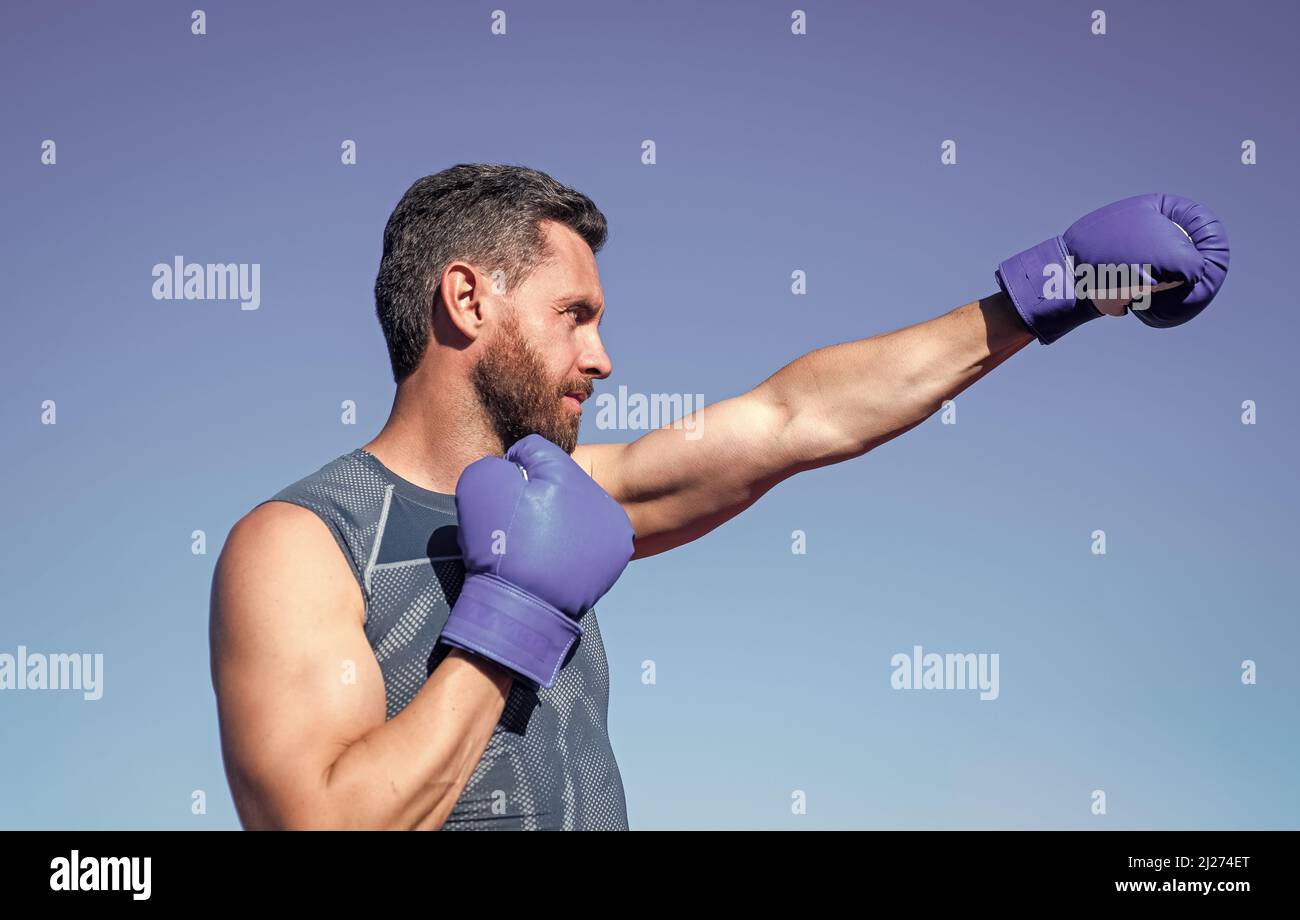athletic muscular man boxer boxing in gloves, punching Stock Photo - Alamy