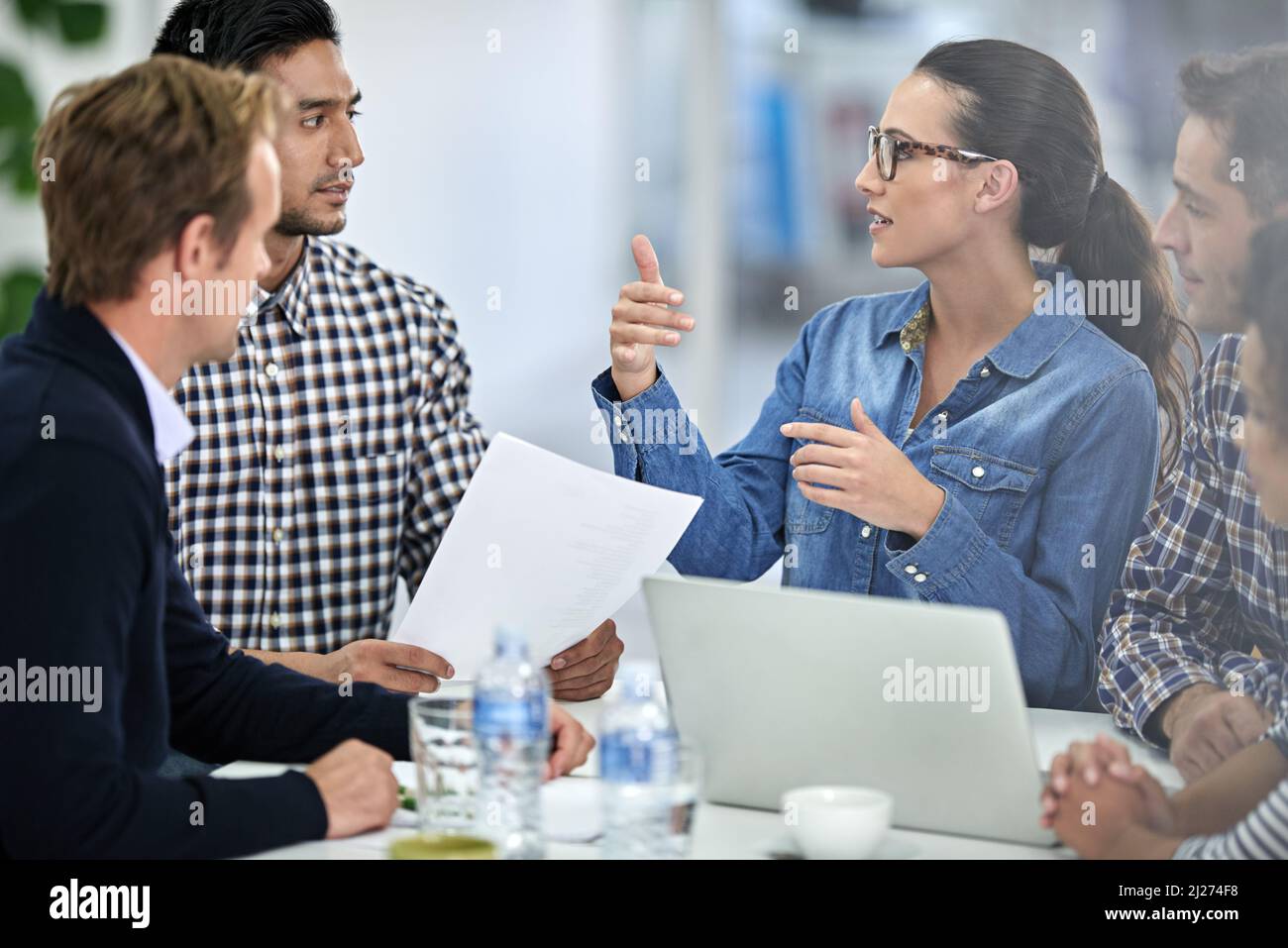She presents her ideas well. Confident businesswoman explaining an idea ...