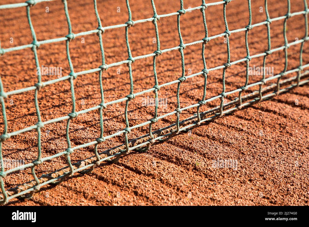 tennis ball with line and net on a sand court Stock Photo - Alamy