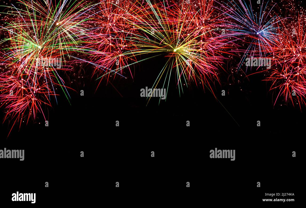 a illustration of colorful fireworks background Stock Photo - Alamy