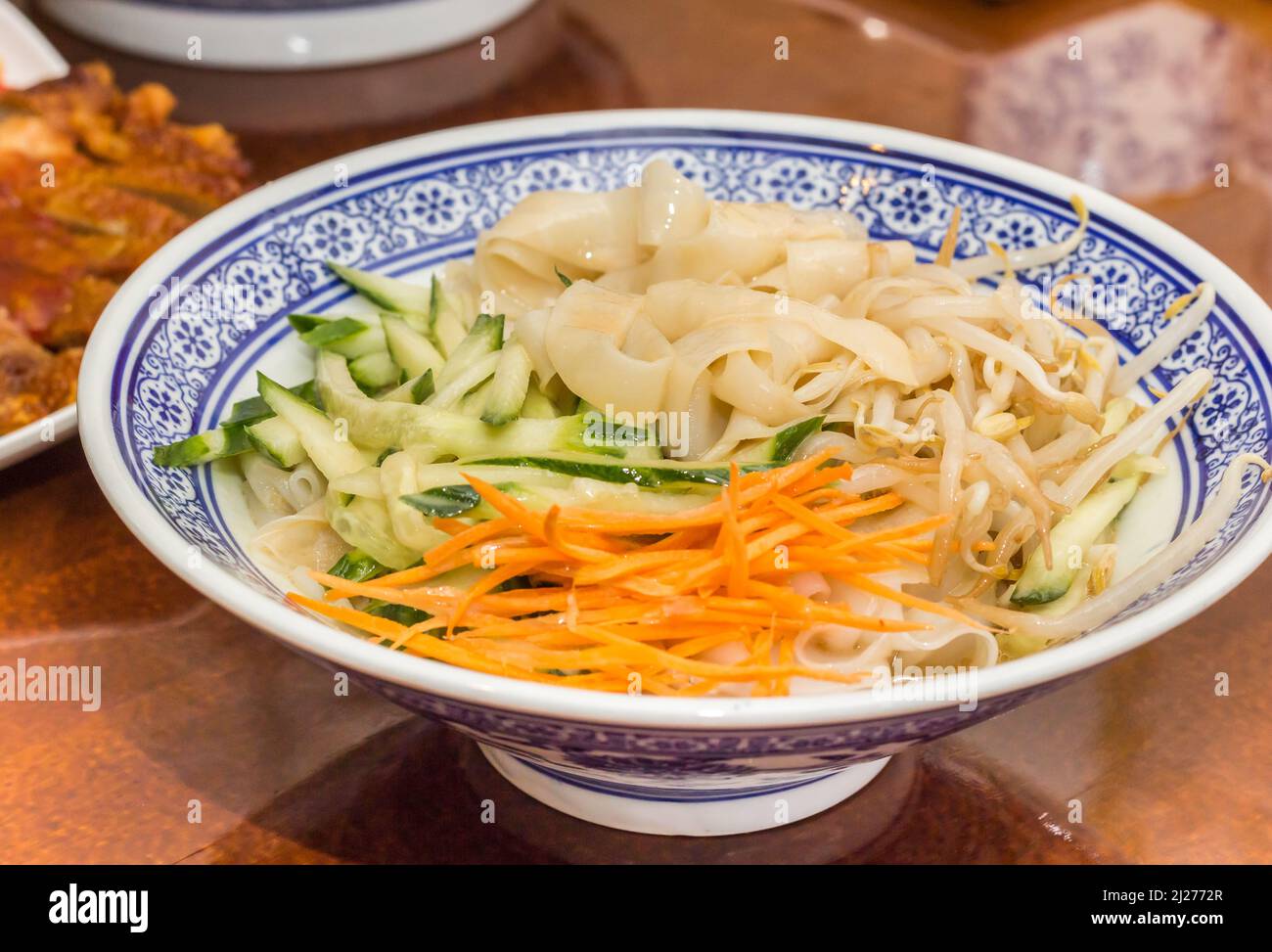 Traditional chinese cold skin noodles (Liang pi) with several ...