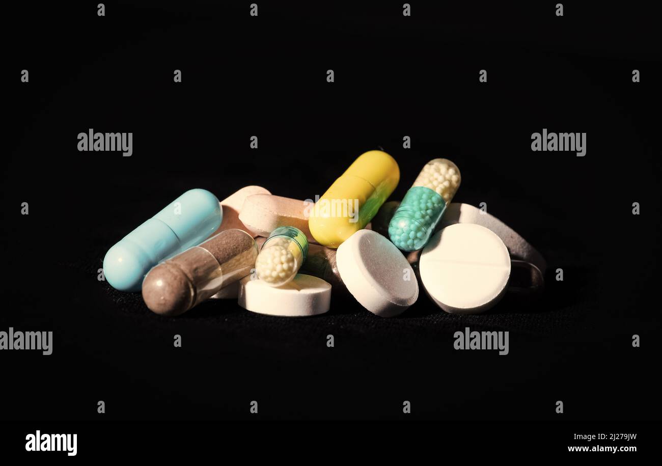 Heap of assorted pharmaceutical medicine pills in tablets and capsules ...