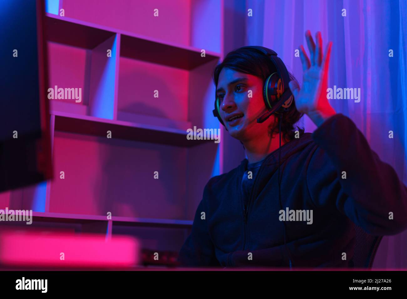 Game stream concept, Male streamer play game online and greeting with ...