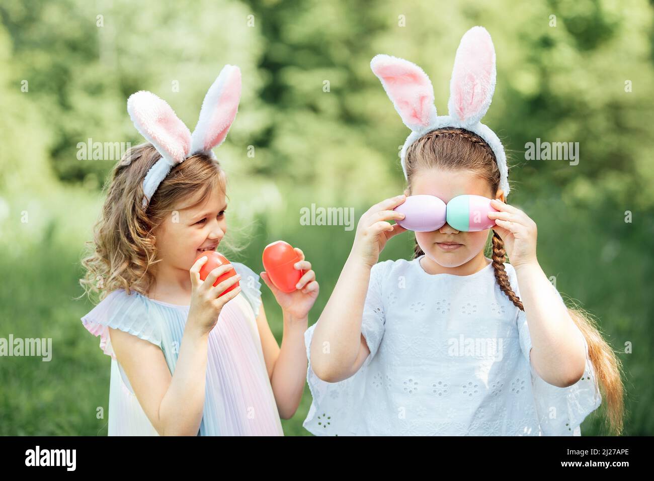 Easter egg hunt. Group Of Children Wearing Bunny Ears Running To Pick ...