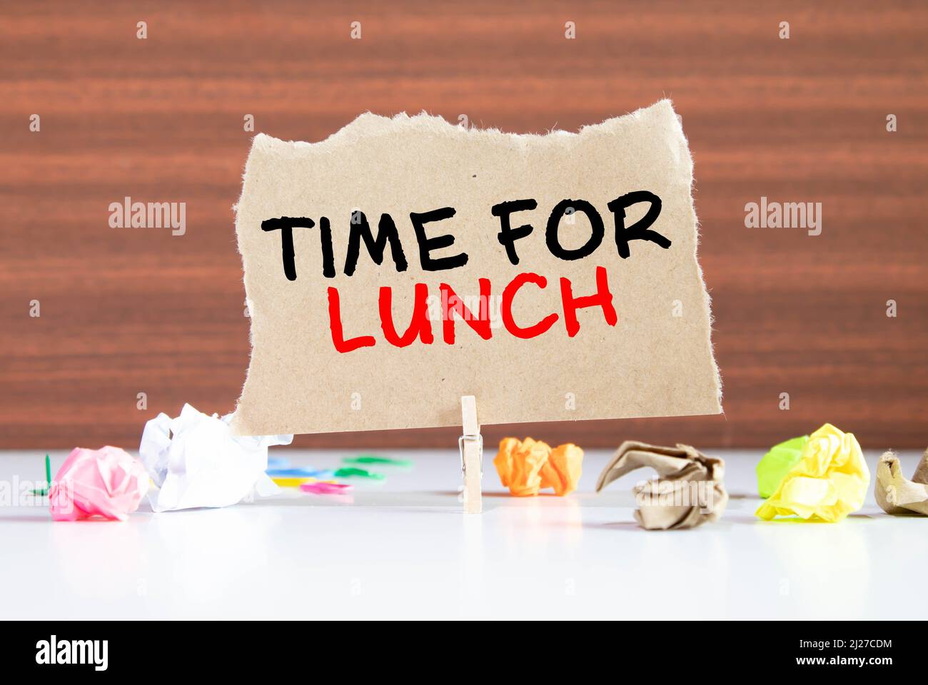 Chalkboard with the words lunch time written on it isolated against a ...