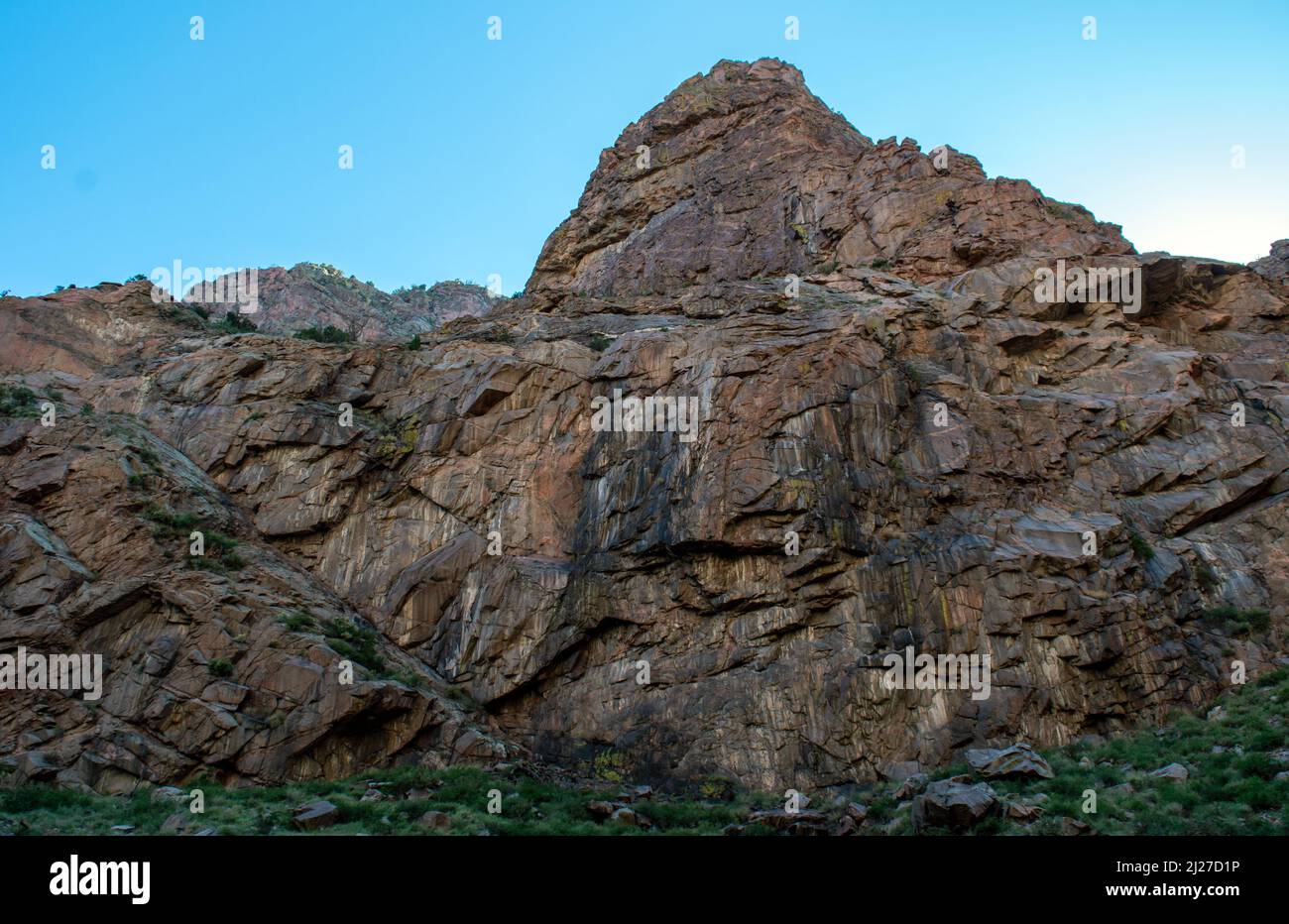 A huge rock formation covered with various shapes, lines and textures ...