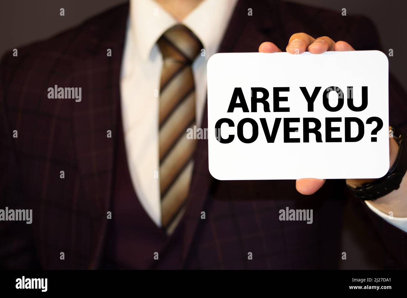 Are you Covered Man holding a card with a message text written Stock ...