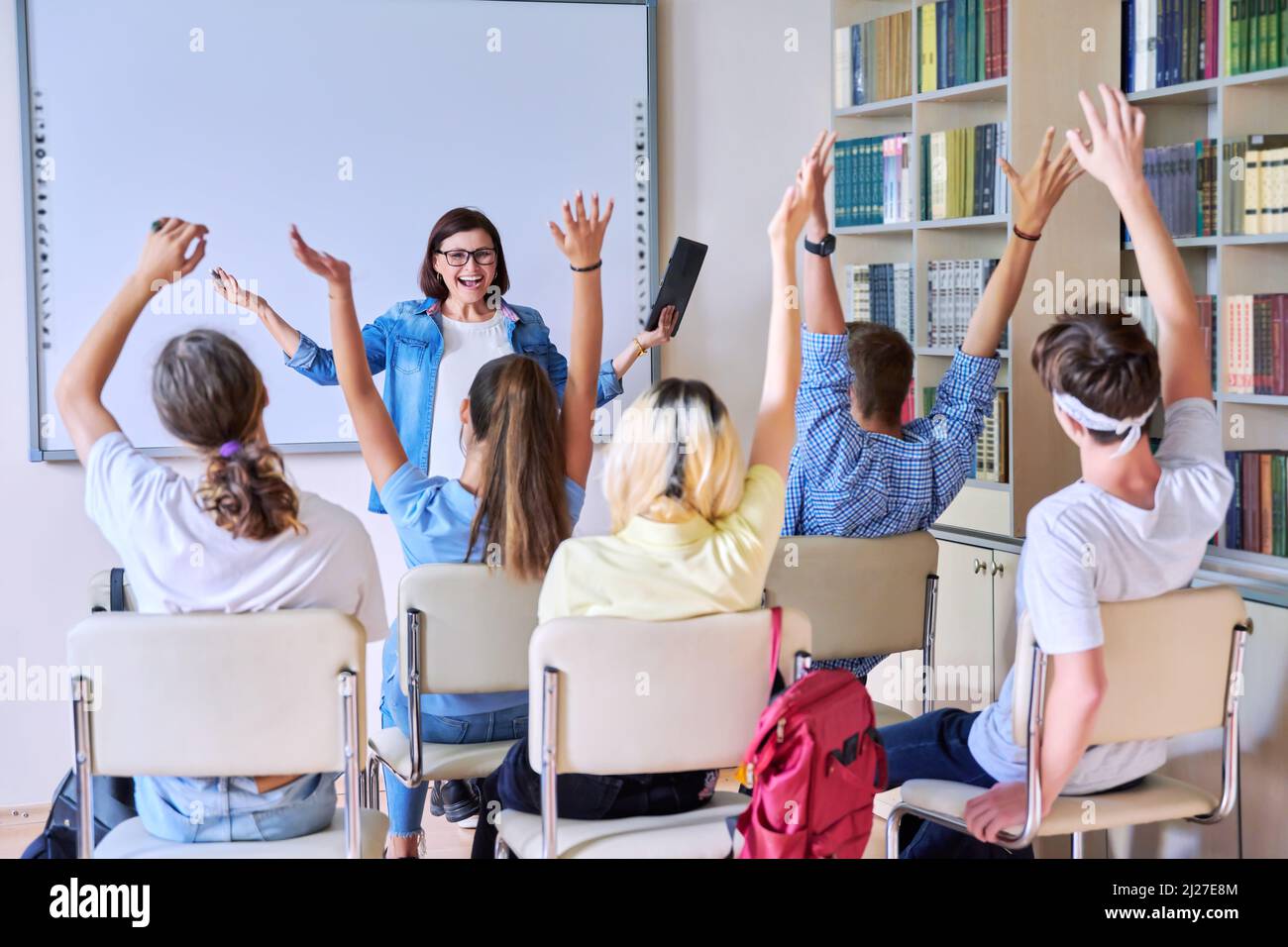 Lesson in classroom with digital screen for group of teenagers Stock ...