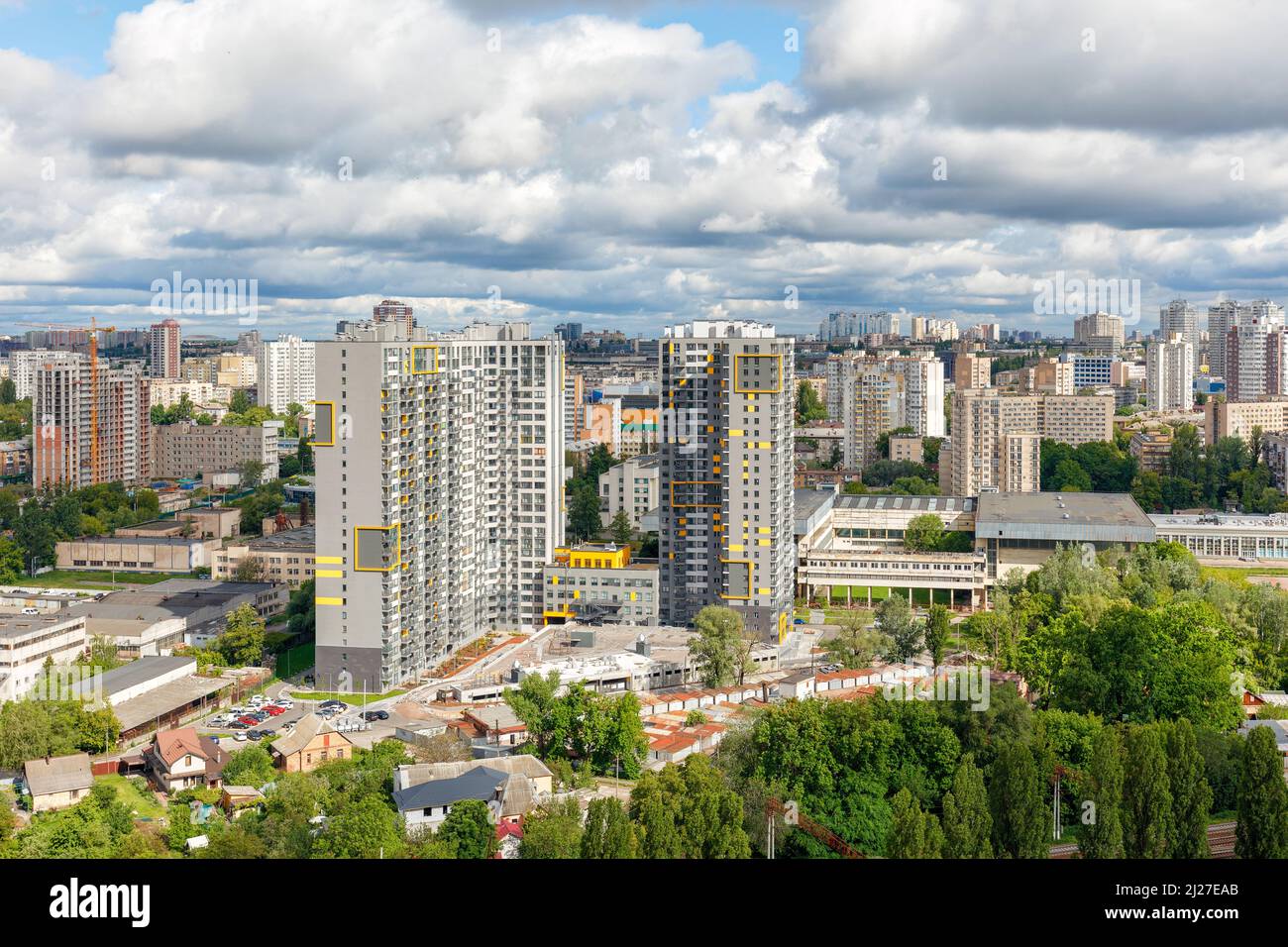 City view with old residential buildings and new high rise buildings hi ...