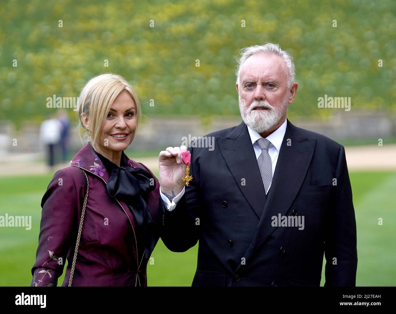 Queen drummer Roger Taylor with his wife Sarina, after being made an ...