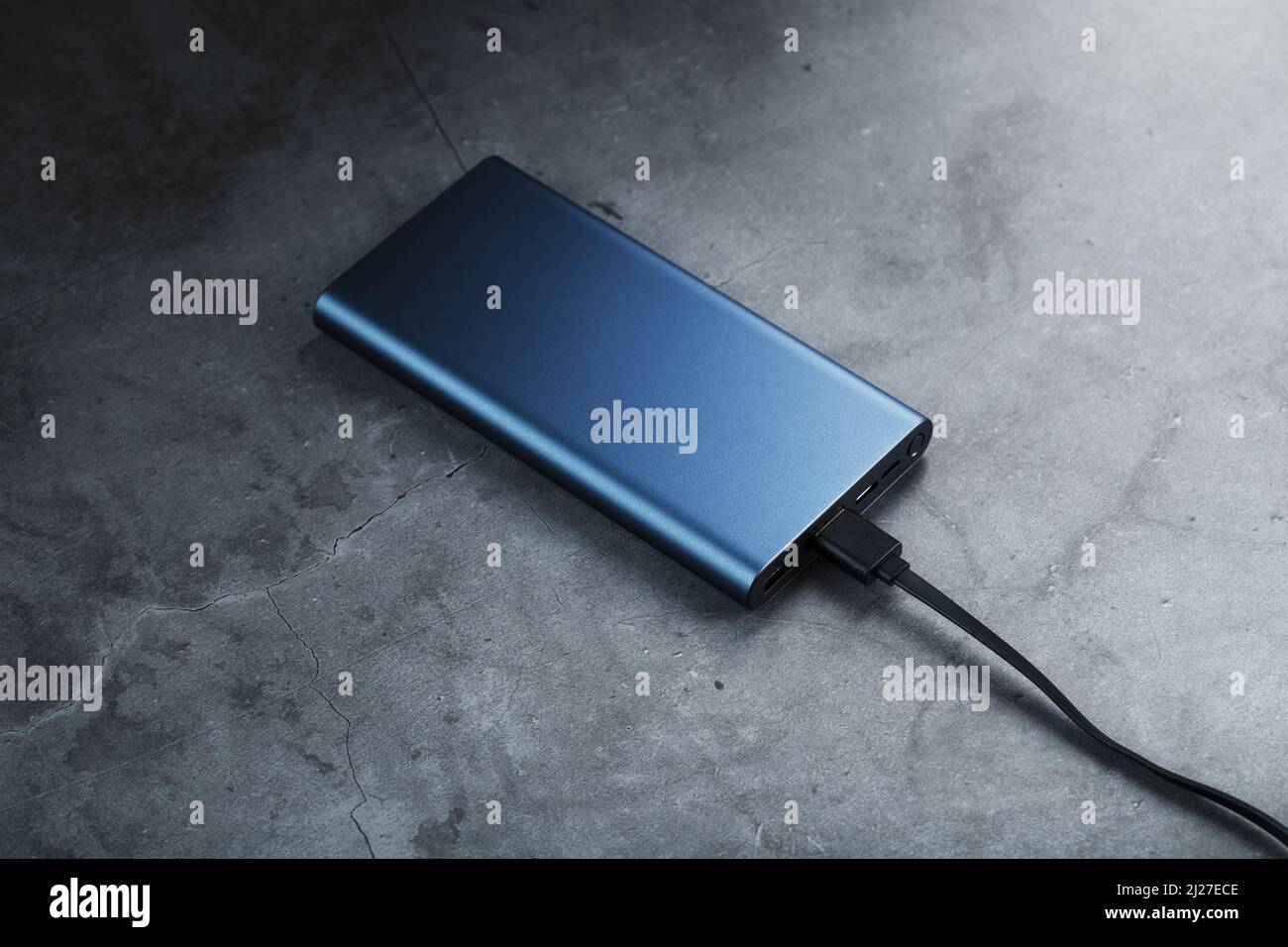 Portable External Battery Power Bank blue with USB Cord Stock Photo - Alamy