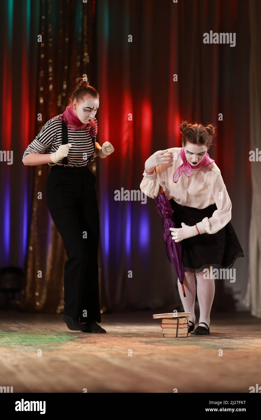 Actress girls clowns show performance on stage Stock Photo - Alamy