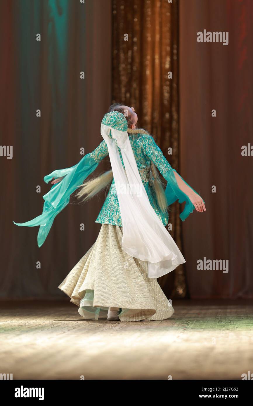 Girls dancers perform on stage with multi-colored lights. Backstage ...