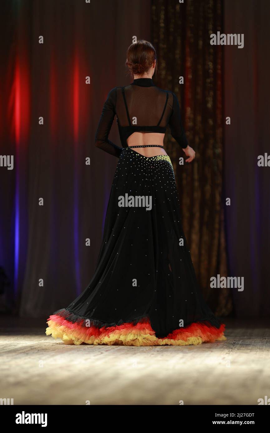 Girls dancers perform on stage with multi-colored lights. Backstage ...