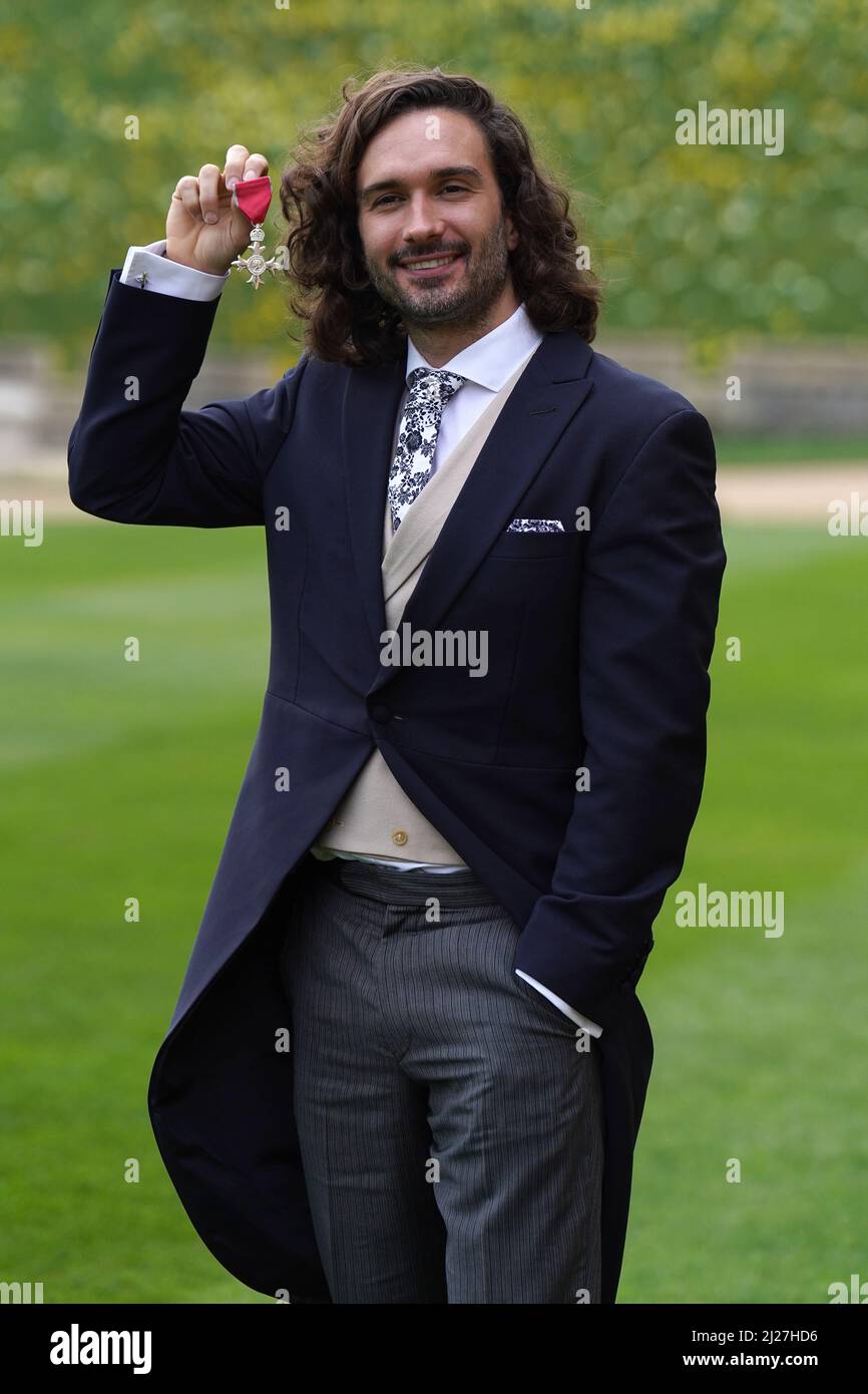 Joe Wicks after receiving his MBE medal from the Prince of Wales during ...