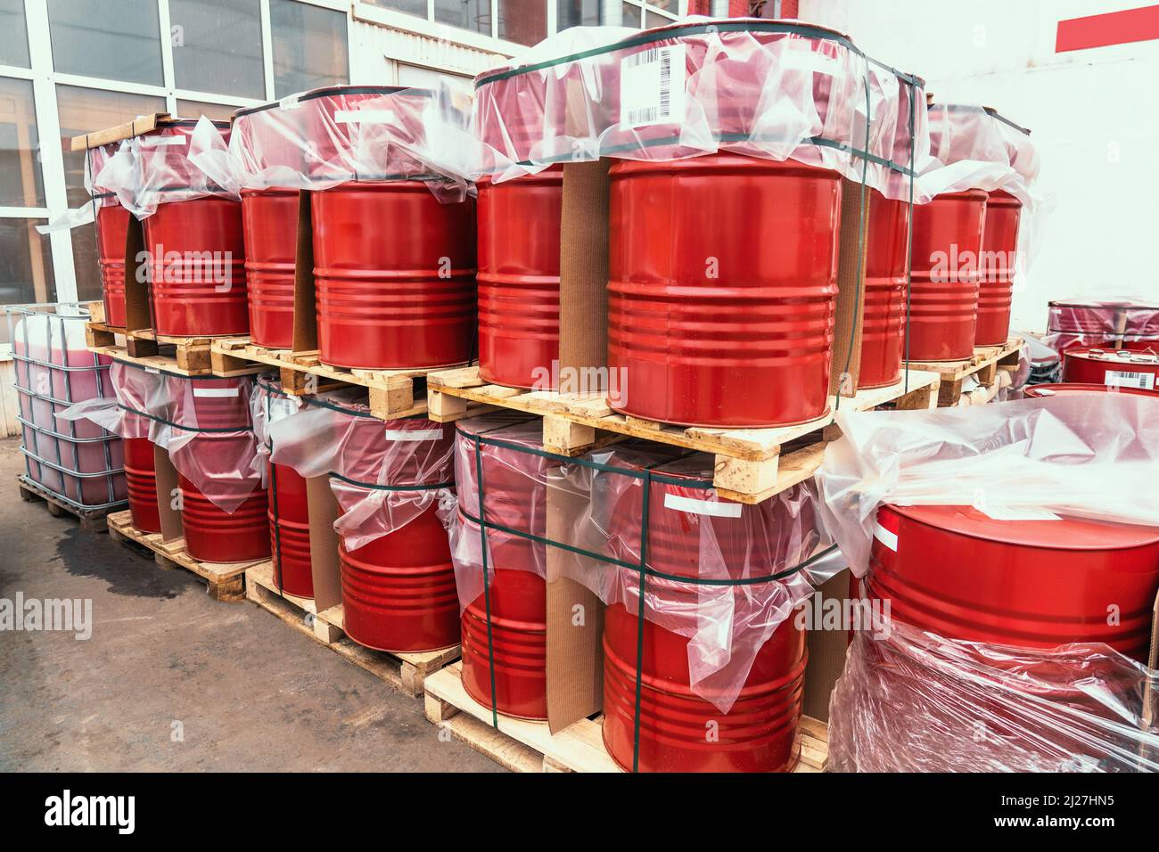Pallets with red barrels of oil, gasoline or machine oil Stock Photo ...