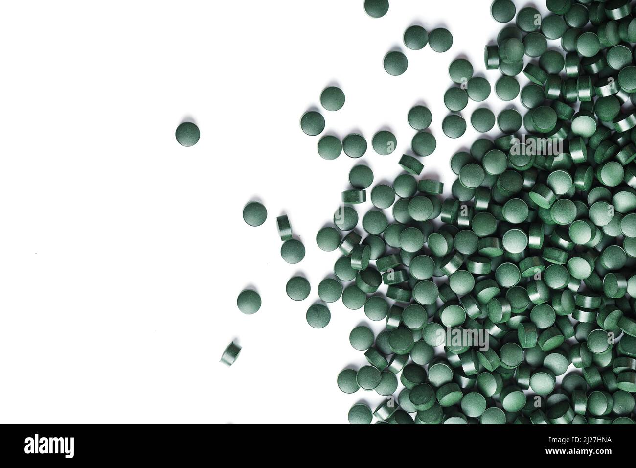 Green tablets made of natural organic spirulina Stock Photo - Alamy