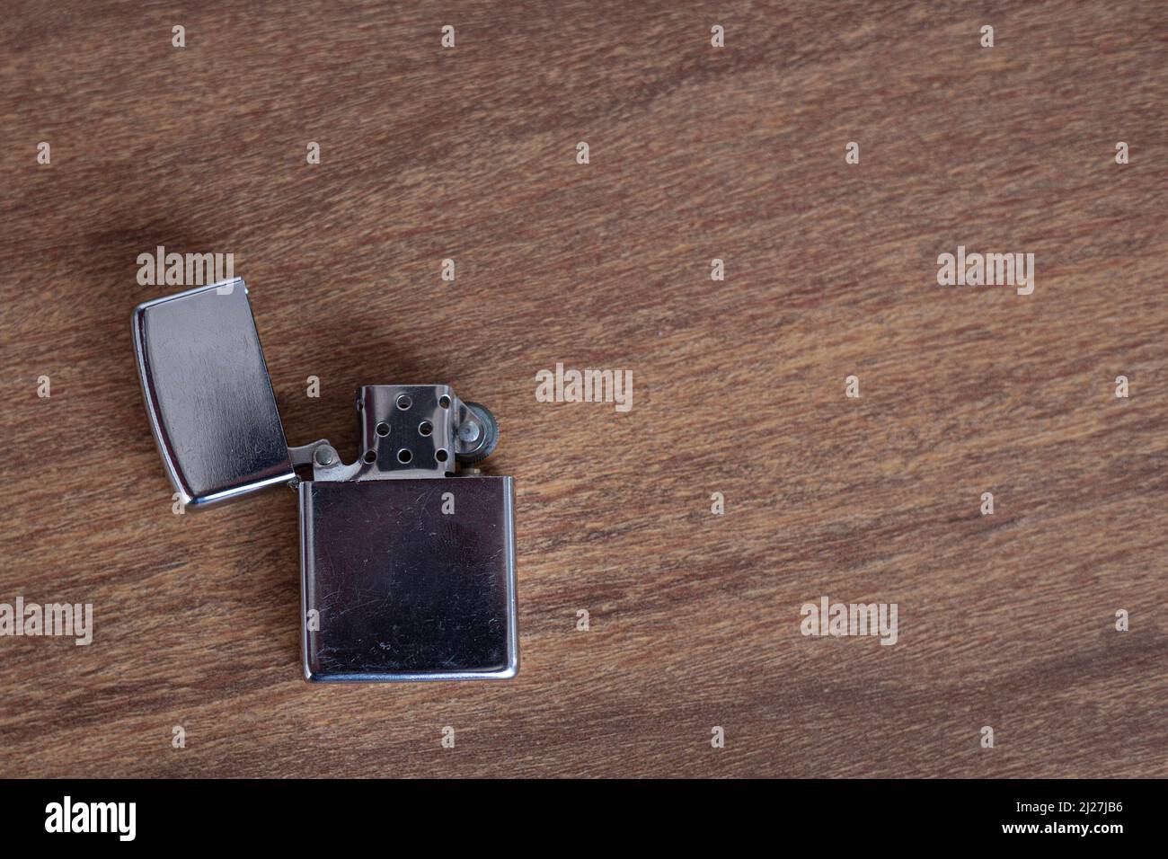 Classic lighter on a table Stock Photo - Alamy