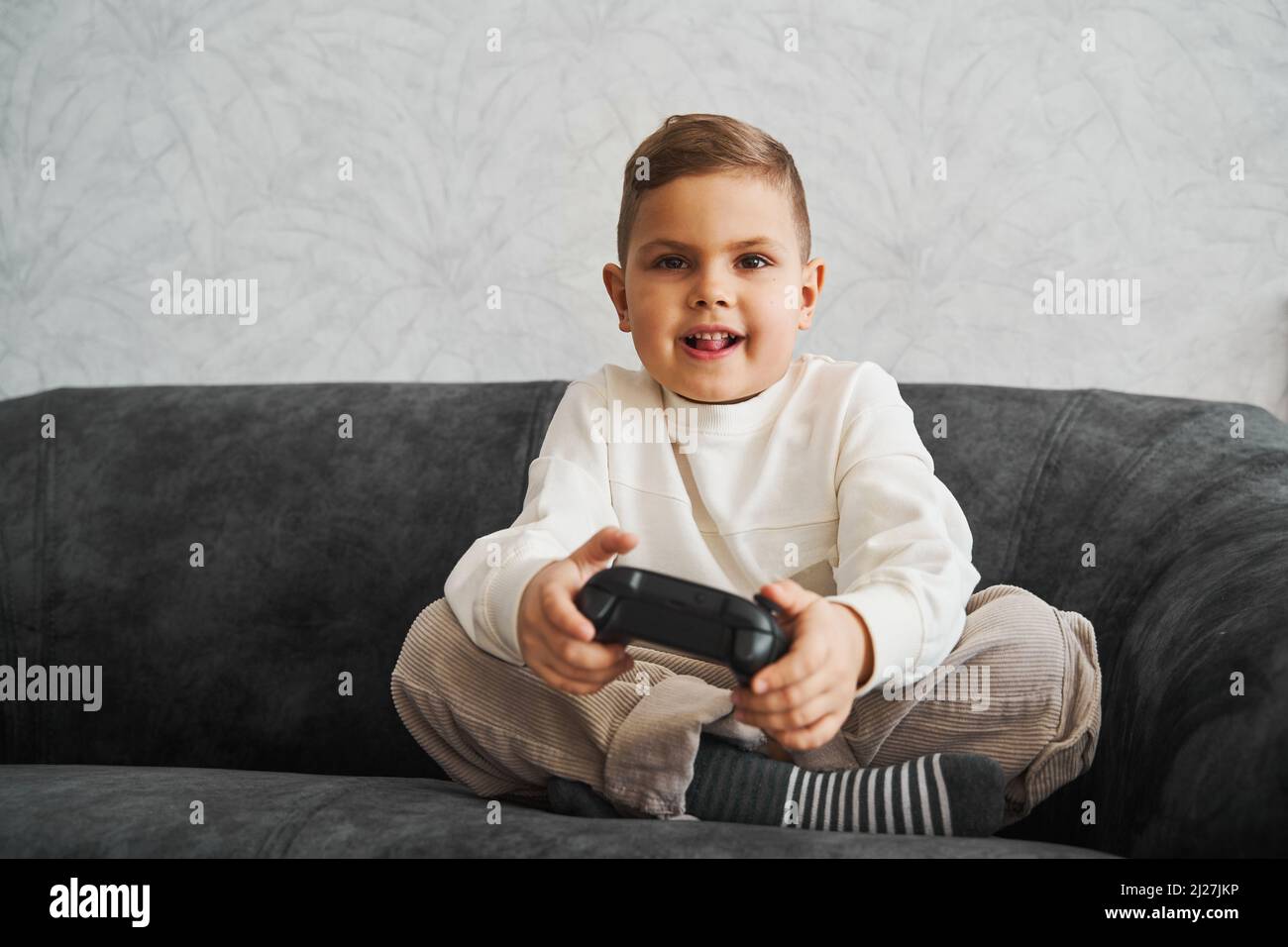Boy celebrating video game hi-res stock photography and images - Alamy