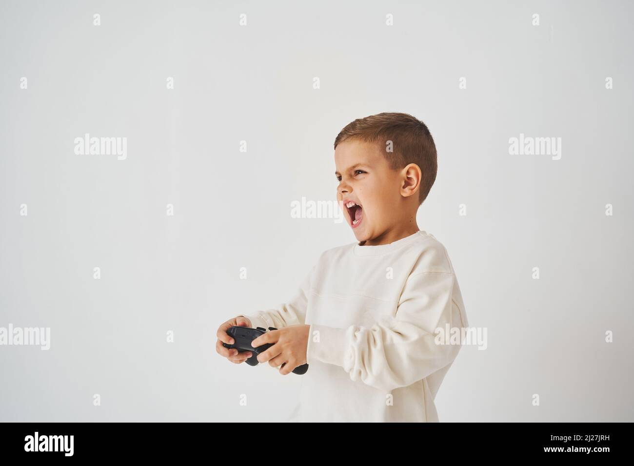 Happy caucasian boy gamepad playing hi-res stock photography and images ...
