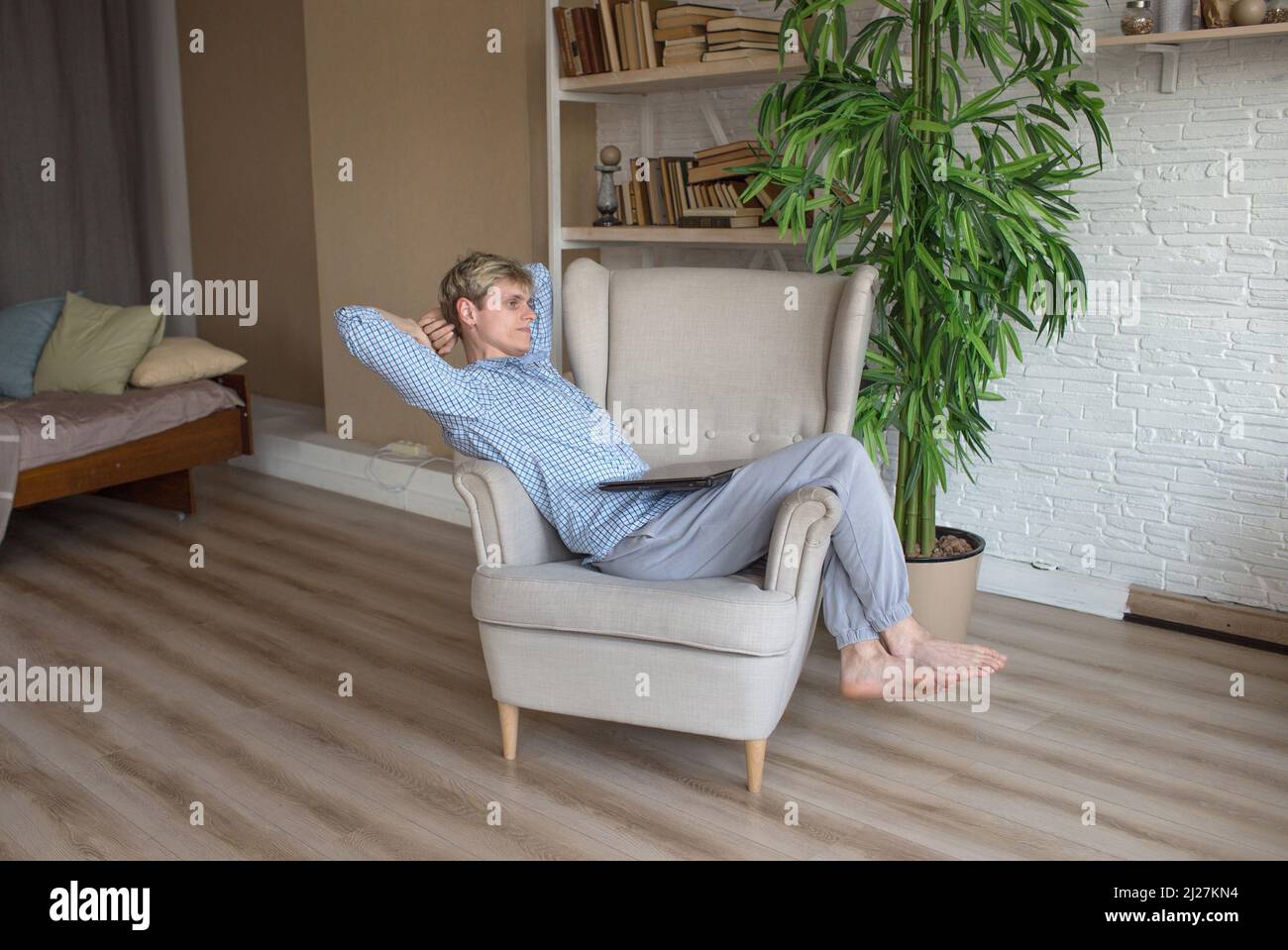 Guy back working laptop chair hi-res stock photography and images - Alamy