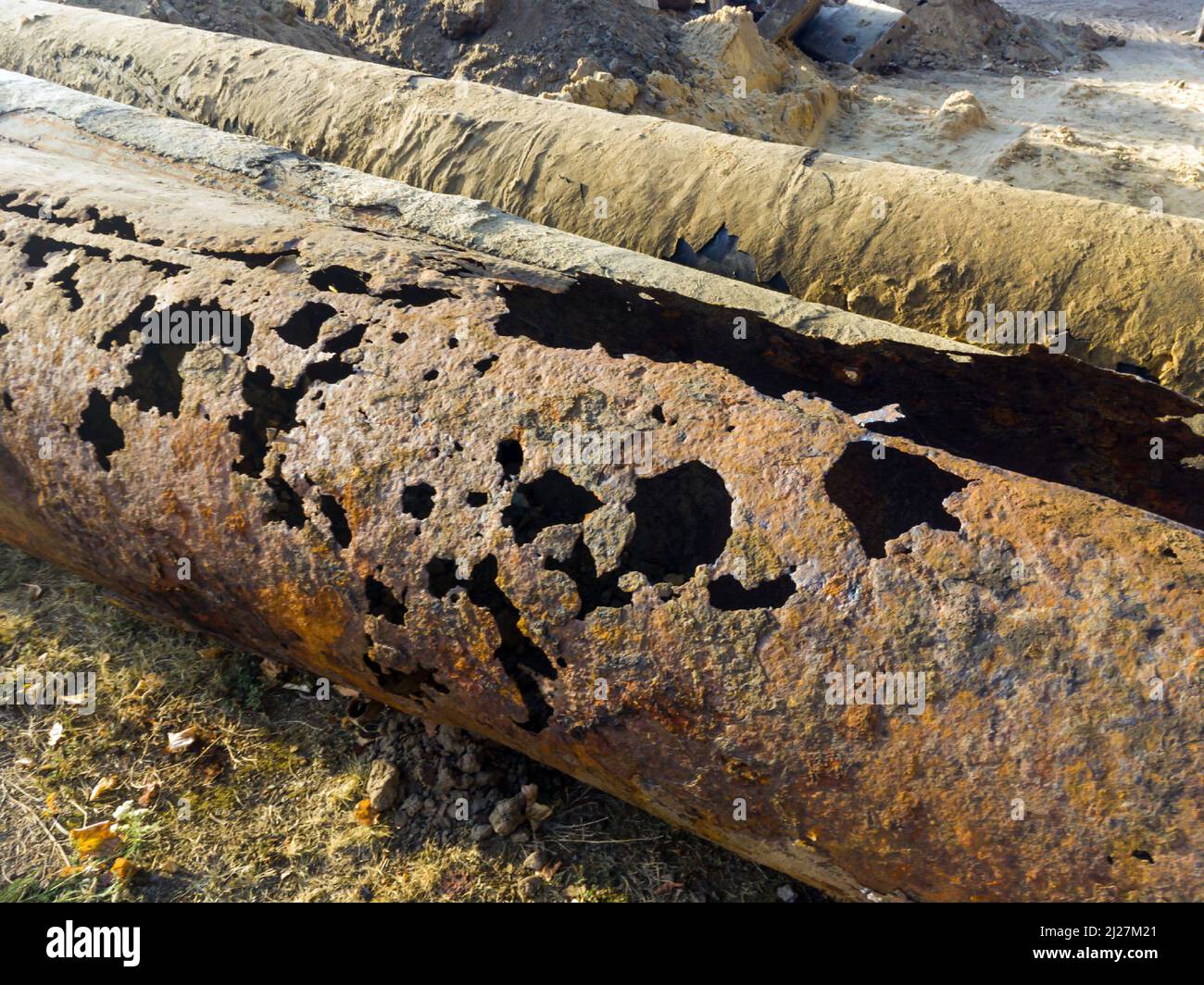 Leaky rusty metal pipes for water supply and heating Stock Photo - Alamy