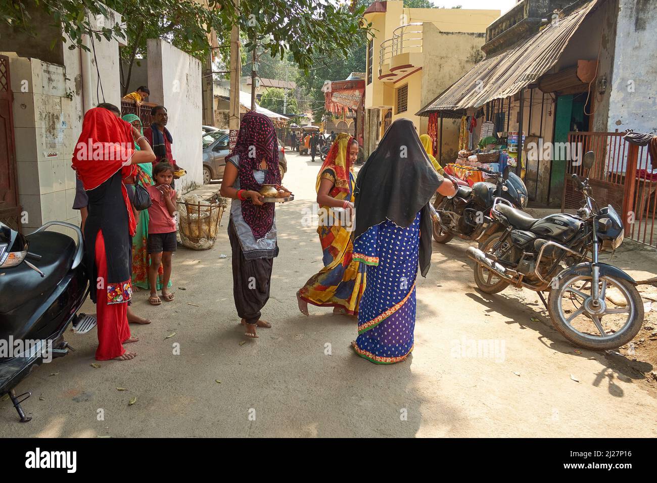 Women with faces covered with traditional garments doing a ritual in ...