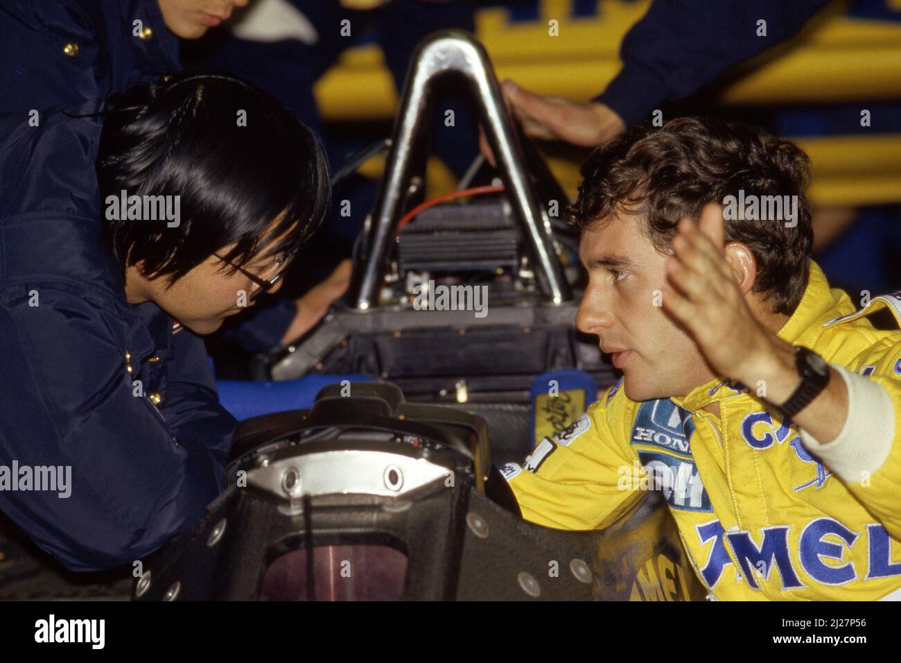 Ayrton Senna da Silva (BRA) Lotus 99T Honda talks with a Honda engineer ...