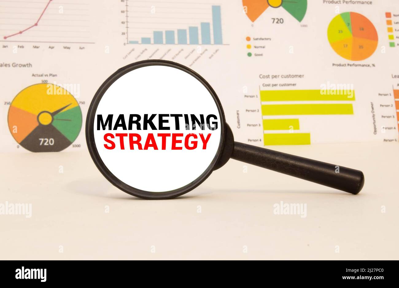 Laptop computer and book with a magnifying glass. Text Marketing ...