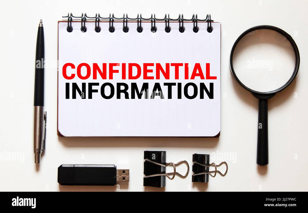 Business concept. Notebook with text confidential information sheet of ...
