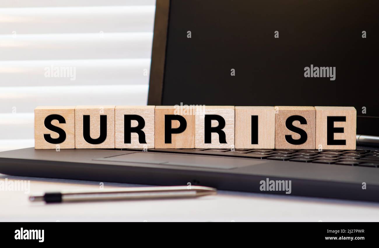 surprise word written on wood block. surprise text on table, concept ...