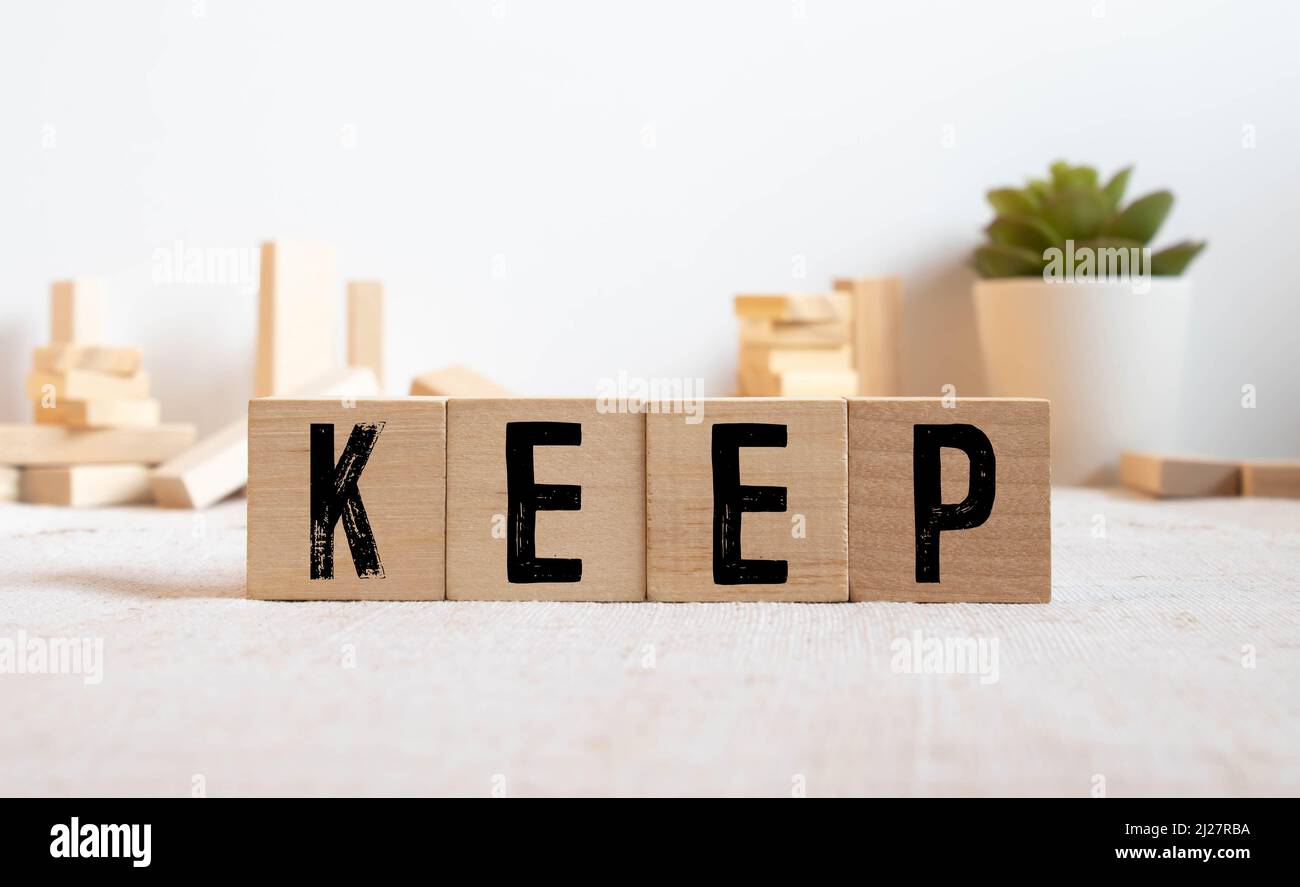 Wooden block with words KEEP with medical mask, health concept ...