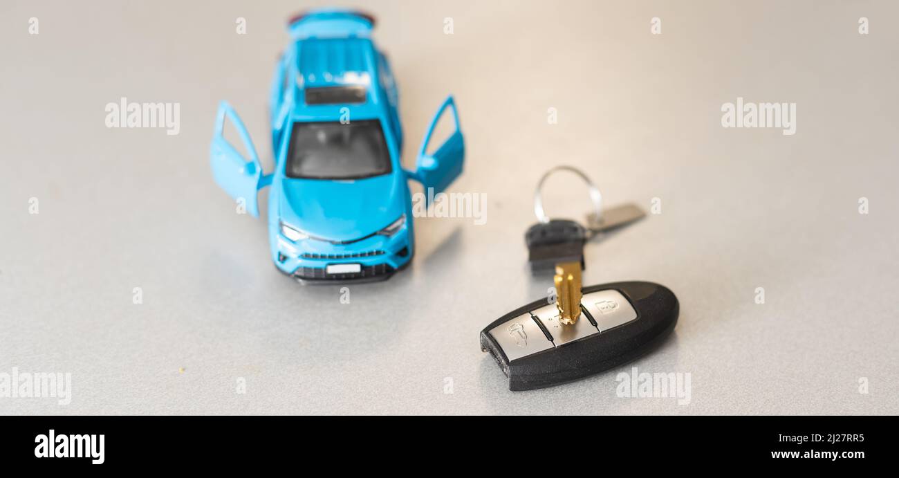 Toy car and keys isolated on white background Stock Photo - Alamy