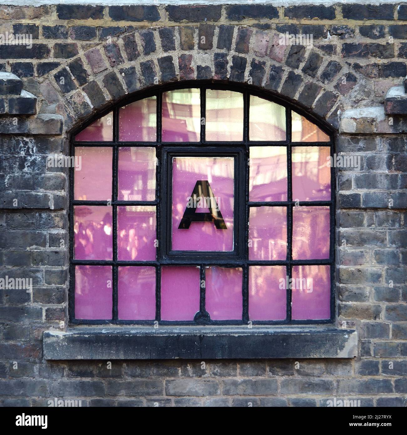 Coal Drops Yard - individual letters in coloured glass windows in old ...