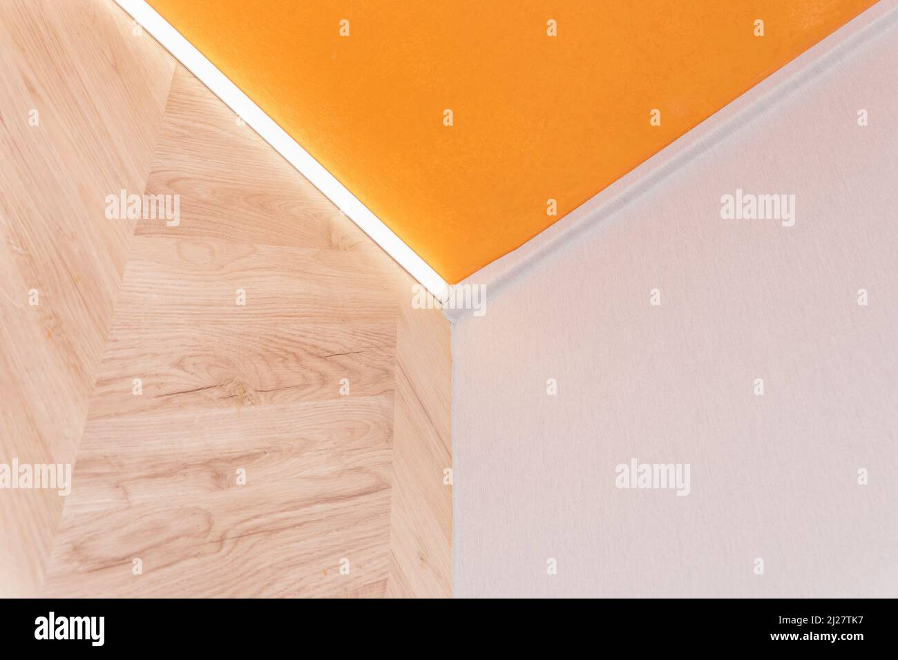 Corner of the room at the ceiling and the joint of the walls element of ...