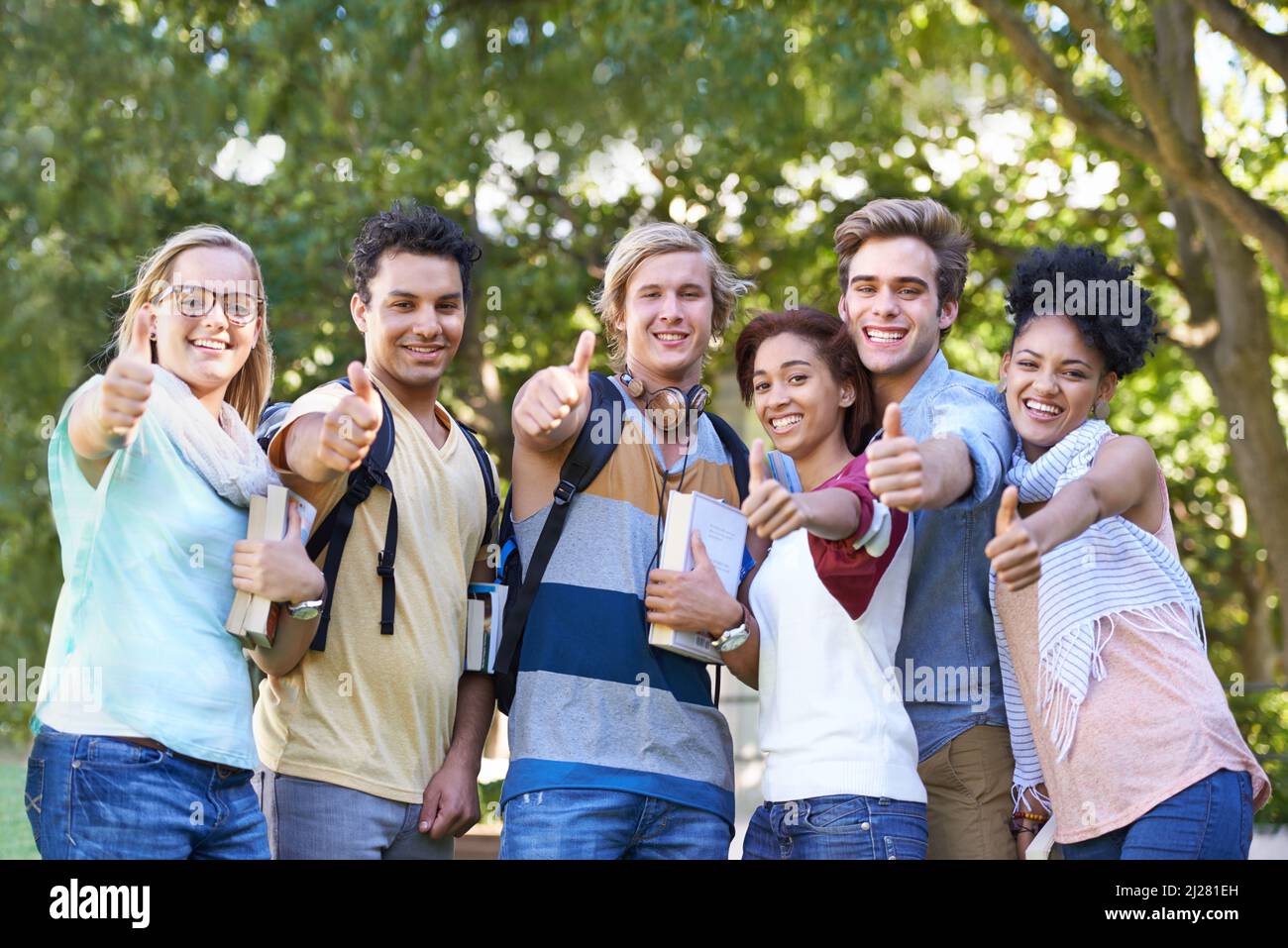 We give this college our stamp of approval. Portrait of a group of ...