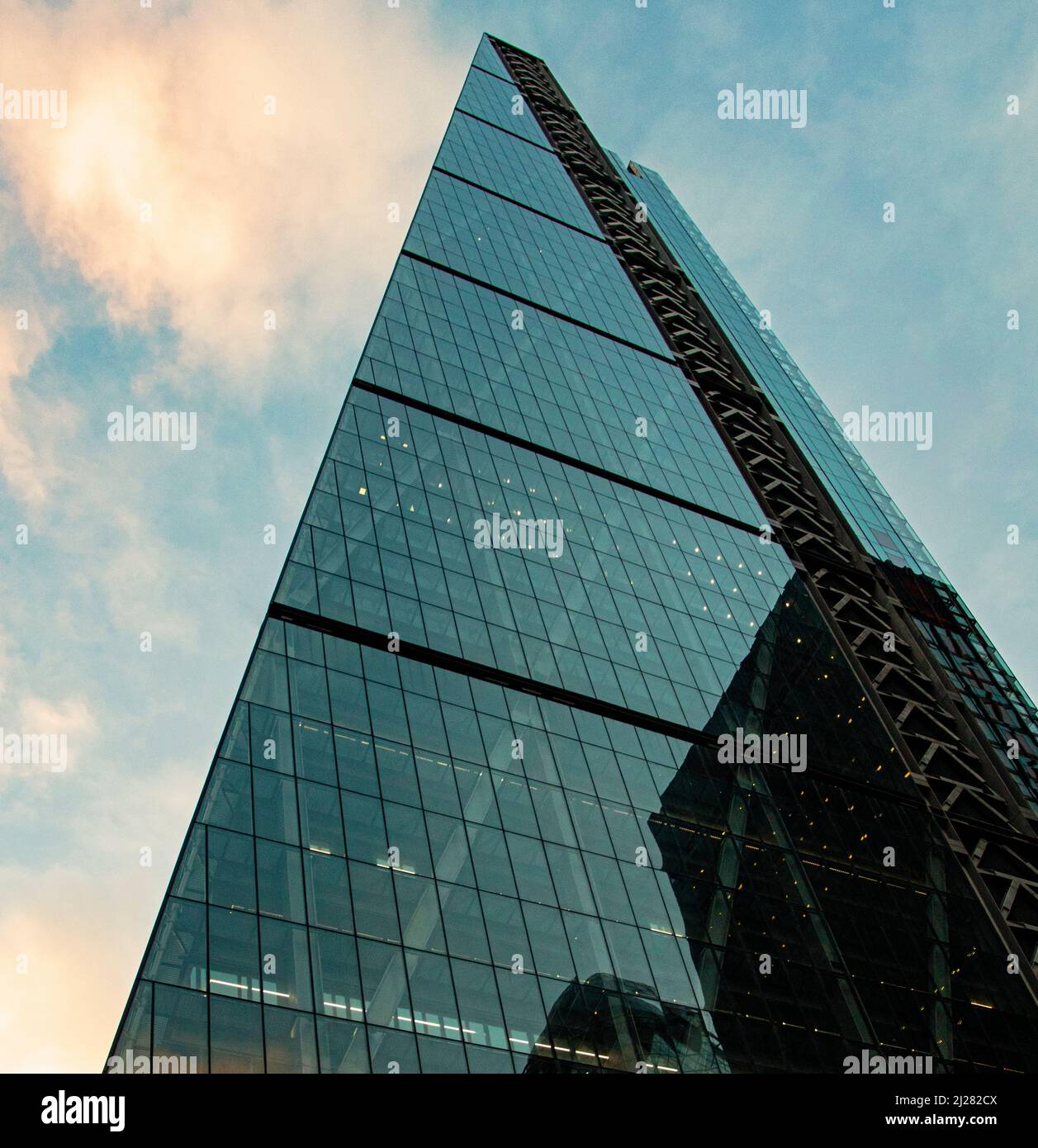 Ultra-modern skyscrapers in Aldgate, London, reflecting the cloudscape ...