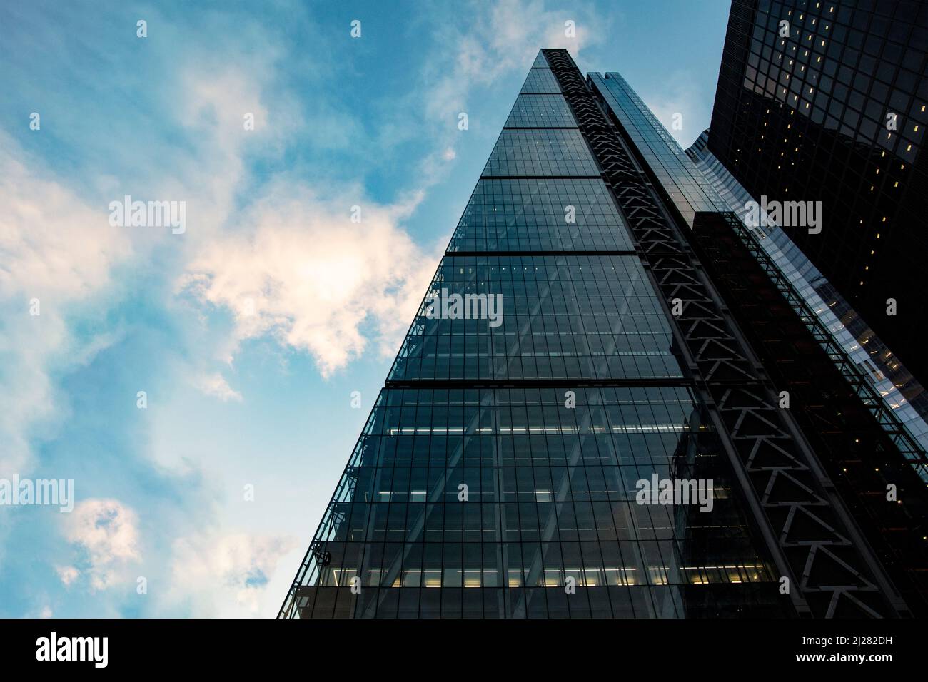 Ultra-modern skyscrapers in Aldgate, London, reflecting the cloudscape ...