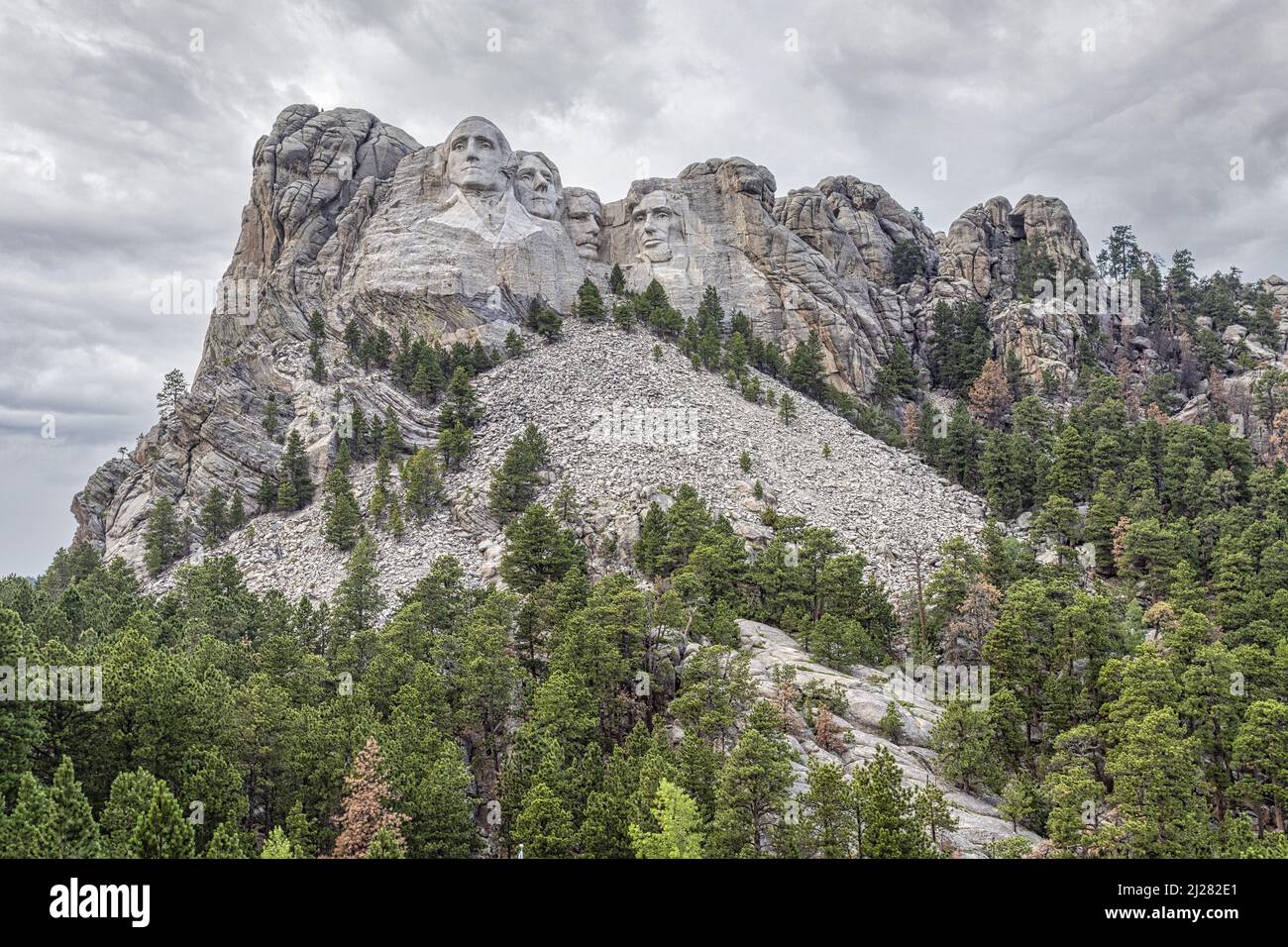 A low angle shot of Mount Rushmore carved with U.S. presidents' faces ...