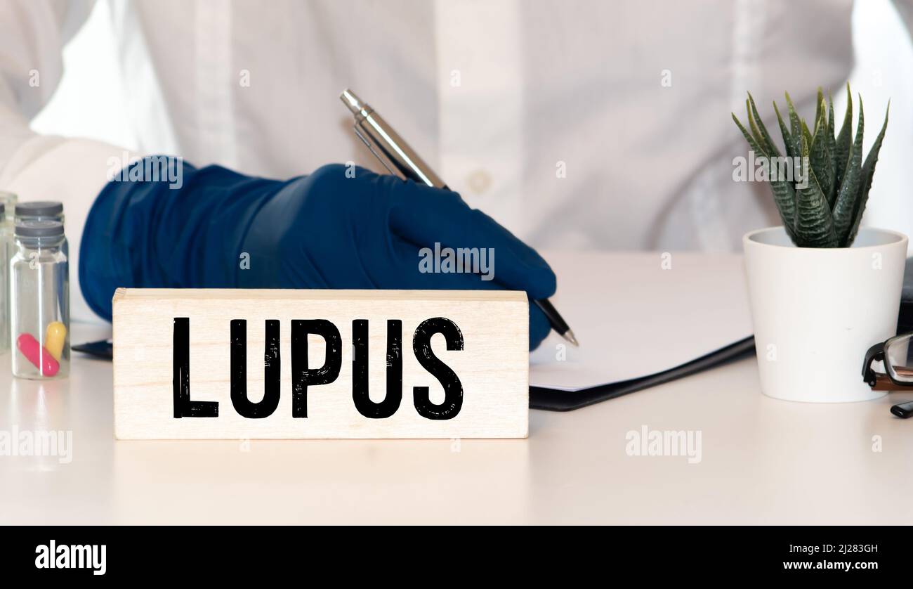 doctor writing word lupus with marker. Medical concept Stock Photo - Alamy