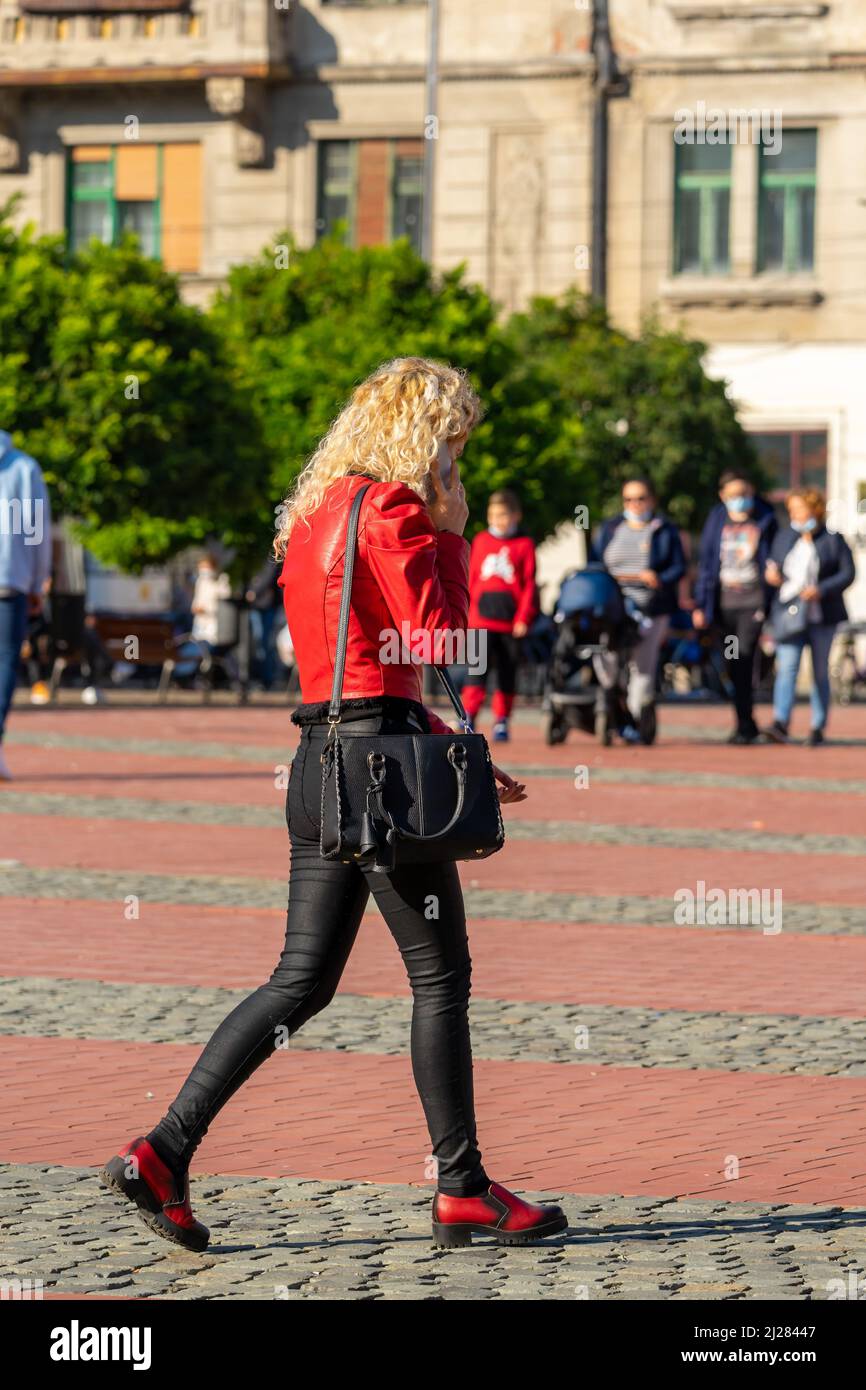 Woman walking on the street. Real people Stock Photo - Alamy