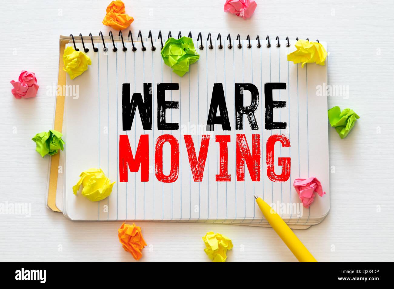 Notepad with text We Are Moving. White background. Business Stock Photo ...