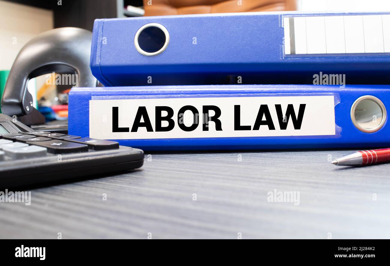 Folder with the label Labor Law, business concept Stock Photo - Alamy