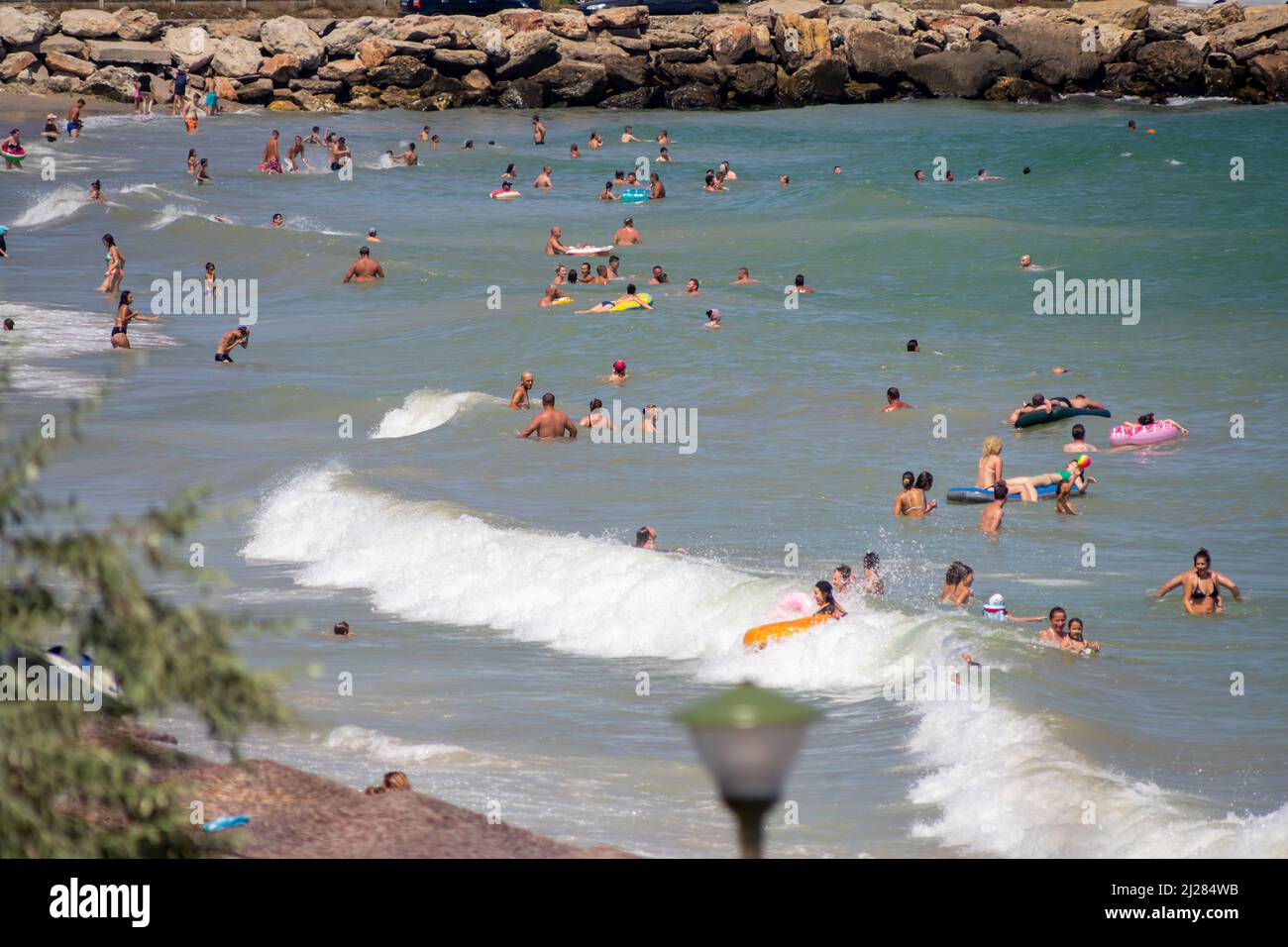 2 Mai, Romania - August 07, 2020: People swimming in the beach Stock ...