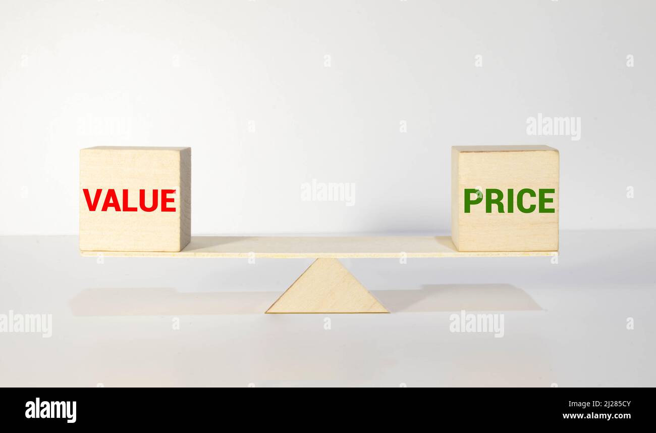 Price and value balance marketing concept. Hand of manager balancing ...