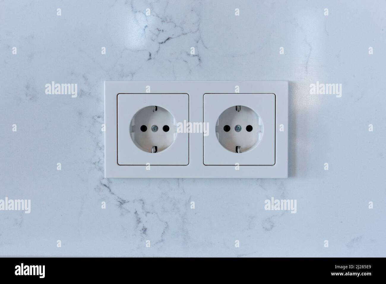 Double electrical socket on a white wall in the room Stock Photo - Alamy