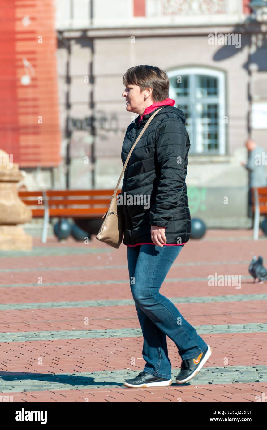 Timisoara, Romania - March 15, 2018: Woman walking on the street. Real ...