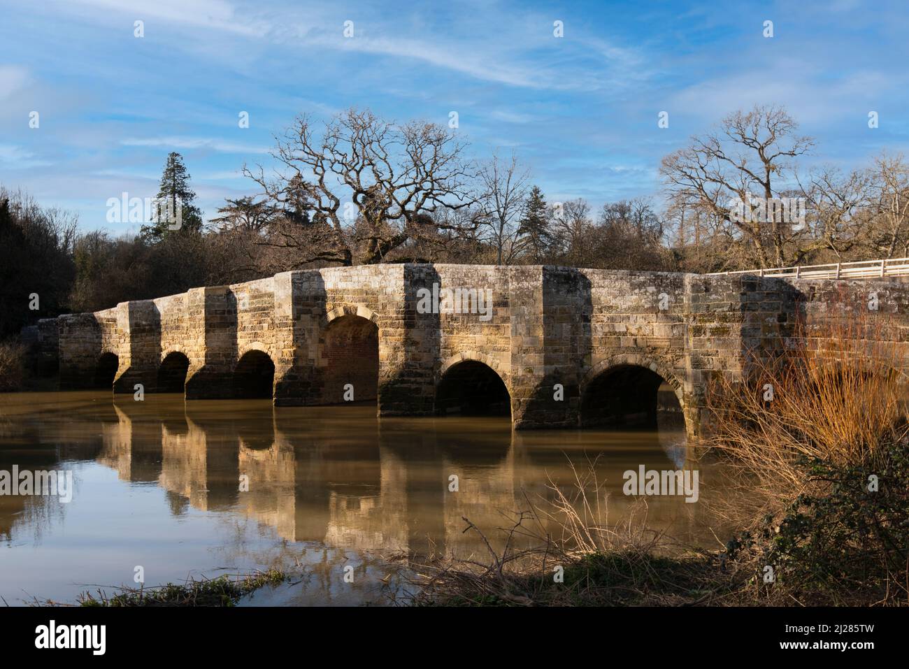 A late winter afternoon at Stopham Bridge over the River Arun, a listed ...